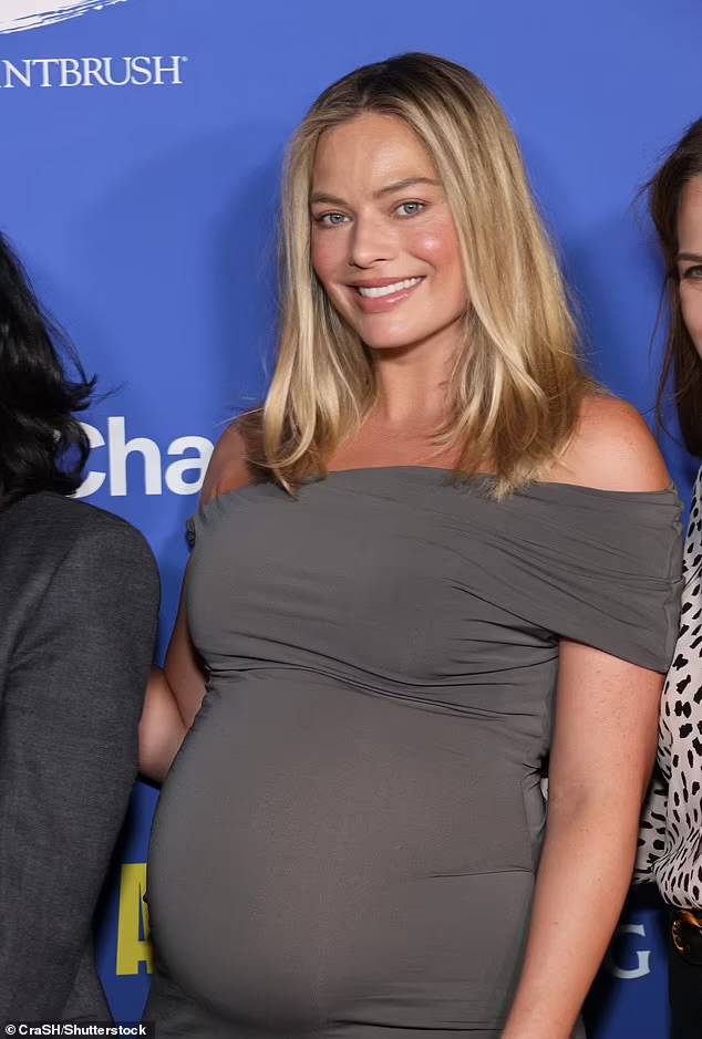 Pregnant Margot Robbie Shows Off Her Growing Bump In A Tight Grey Dress